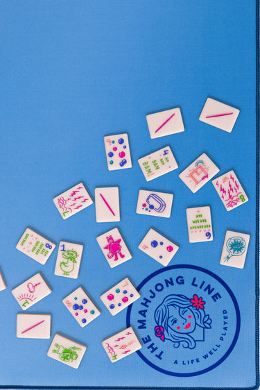 Light blue game mat paired with mahjong tiles– The Mahjong Line