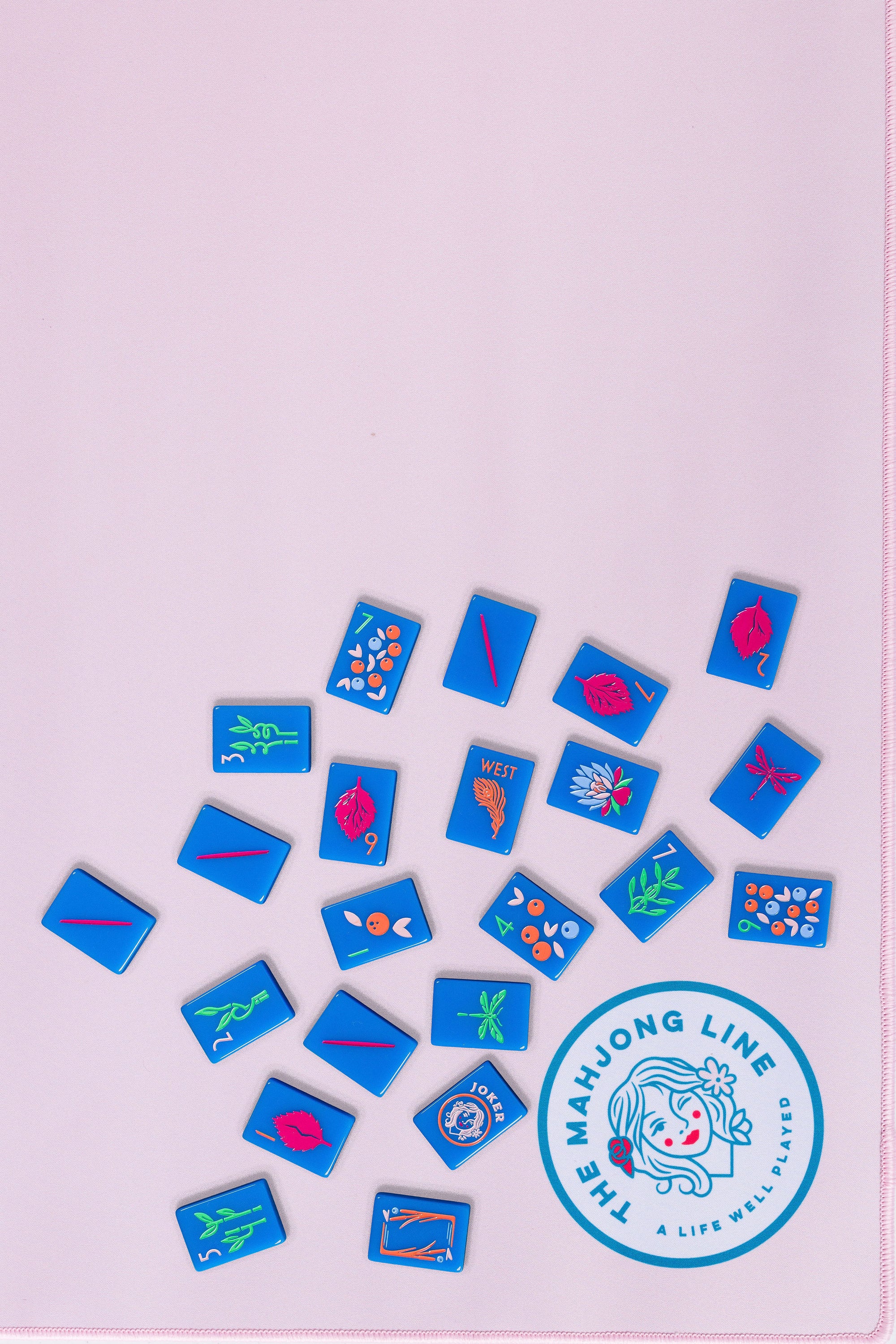 Pink game mat paired with mahjong tiles– The Mahjong Line