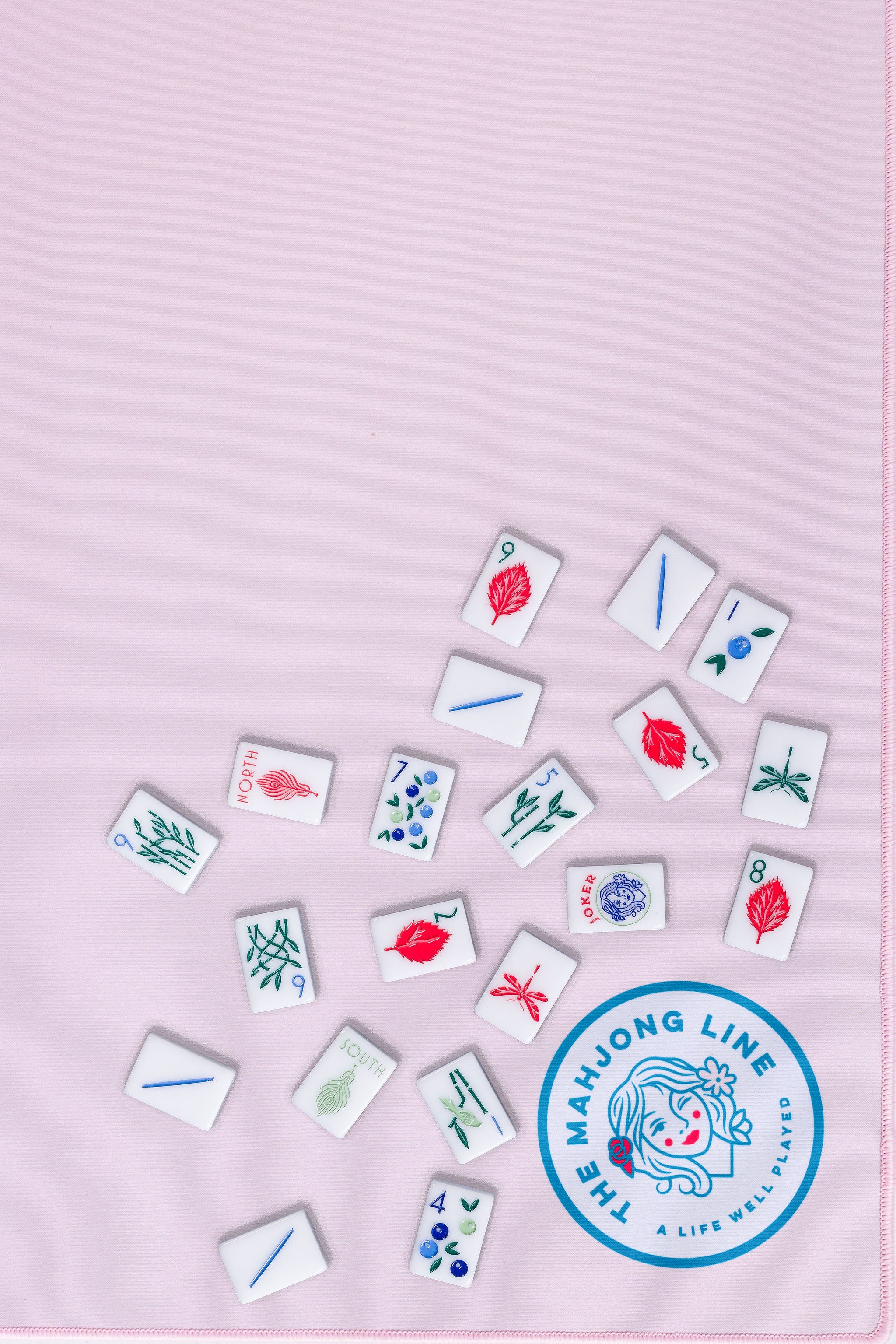 Pink game mat paired with mahjong tiles– The Mahjong Line