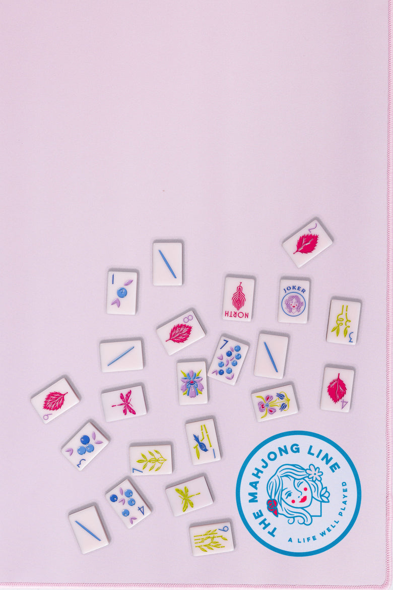 Pink game mat paired with mahjong tiles– The Mahjong Line