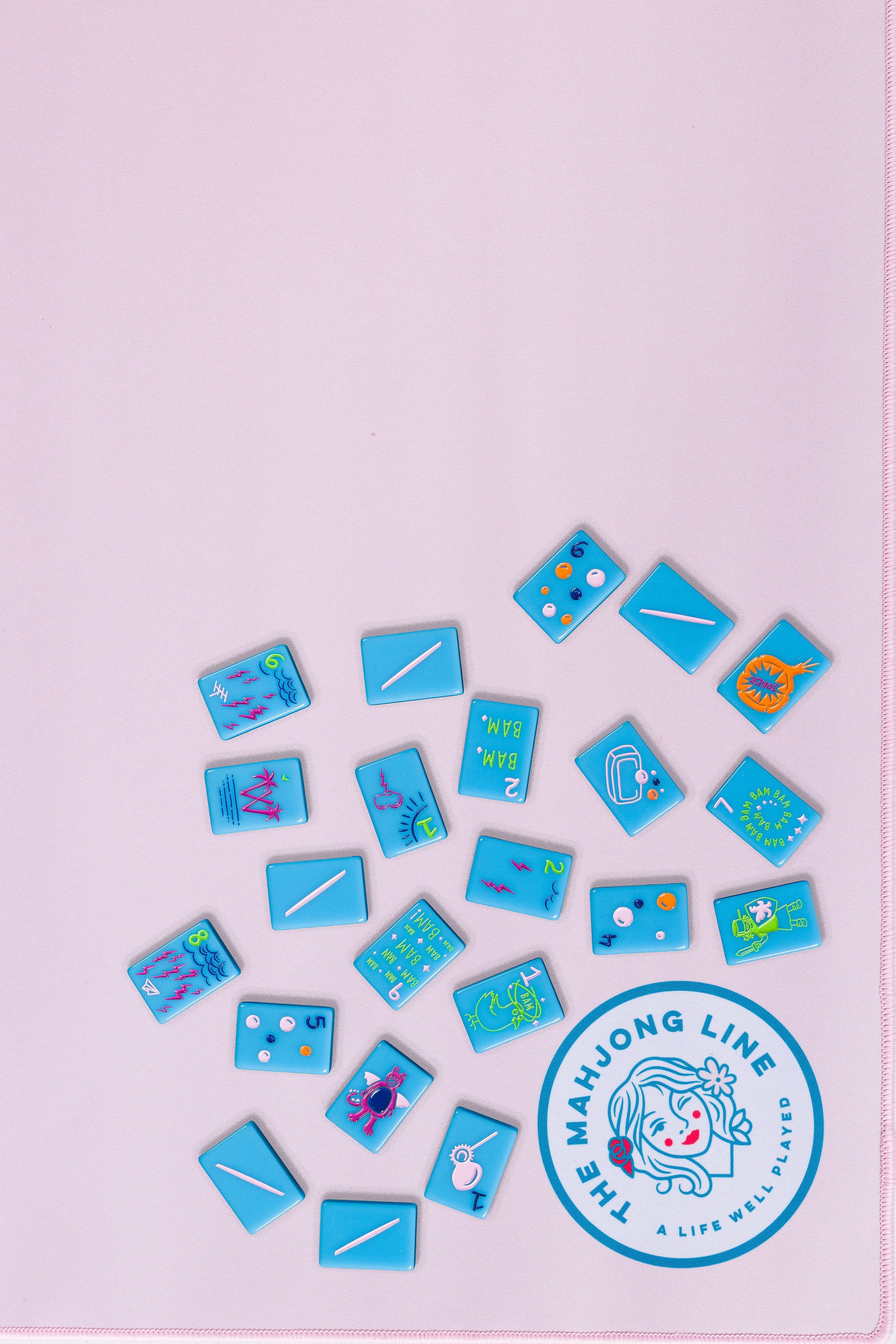Pink game mat paired with mahjong tiles– The Mahjong Line