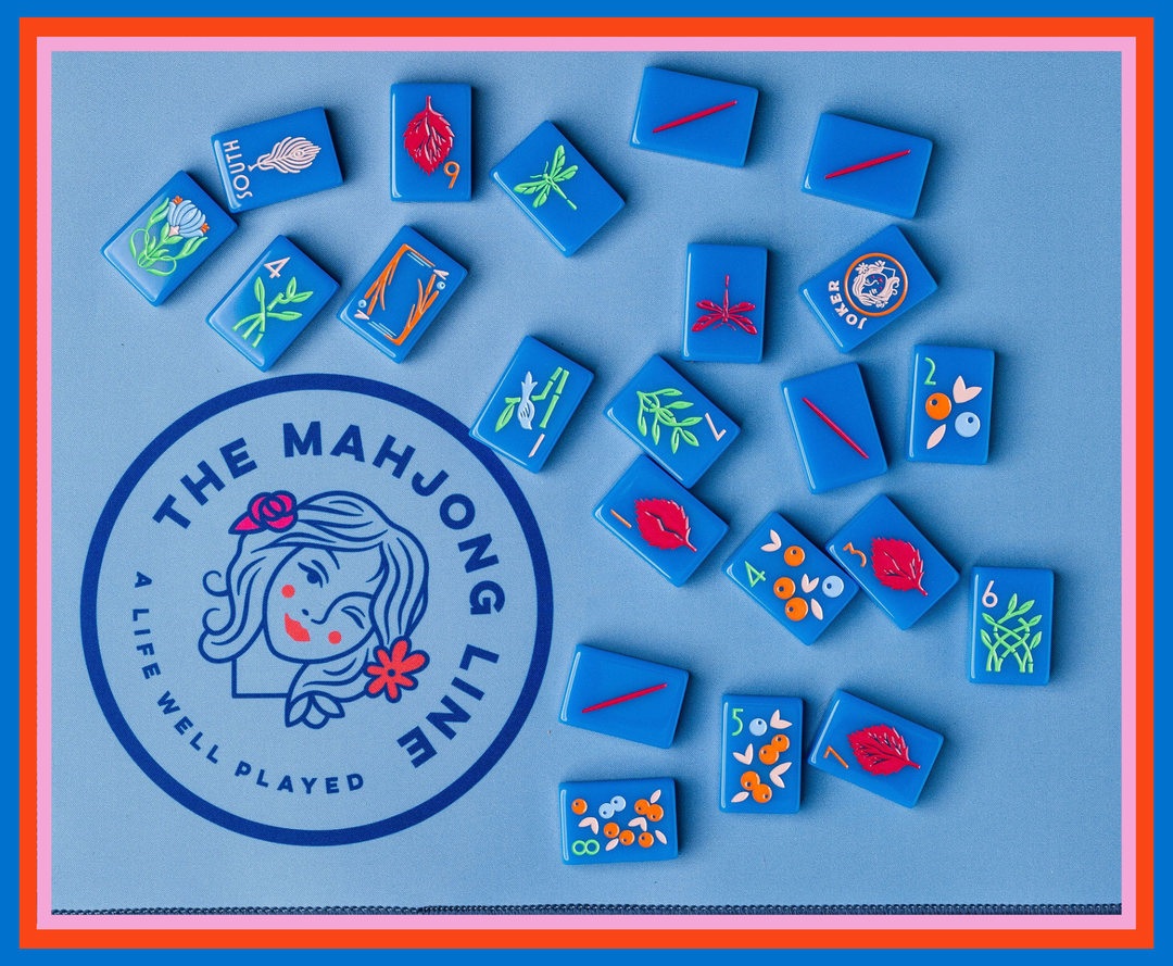 Light blue game mat paired with mahjong tiles– The Mahjong Line