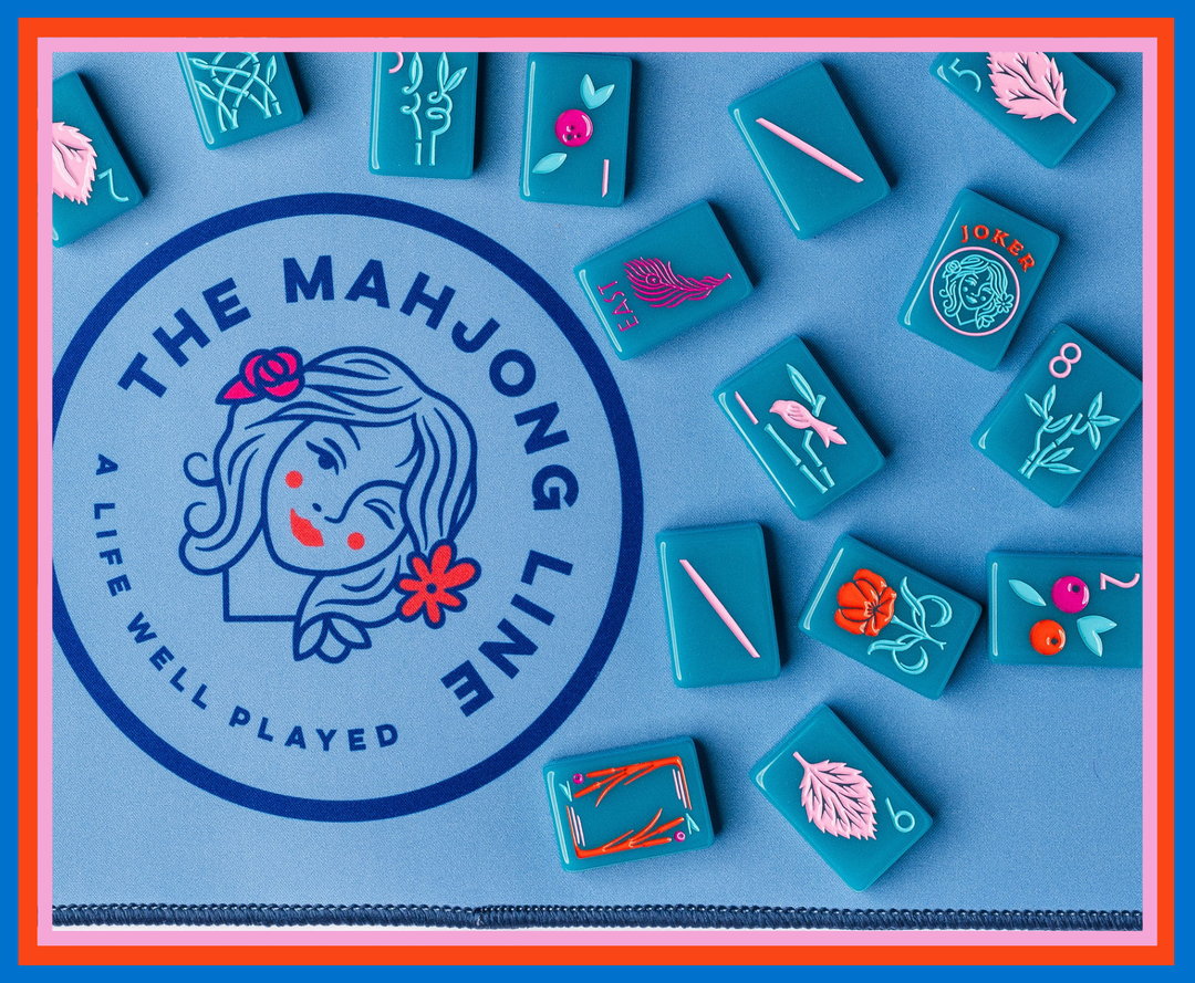 Light blue game mat paired with mahjong tiles– The Mahjong Line