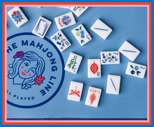 Light blue game mat paired with mahjong tiles– The Mahjong Line
