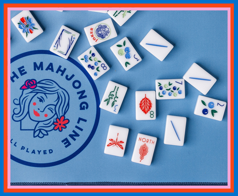 Light blue game mat paired with mahjong tiles– The Mahjong Line
