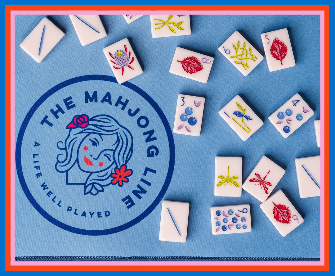 Light blue game mat paired with mahjong tiles– The Mahjong Line