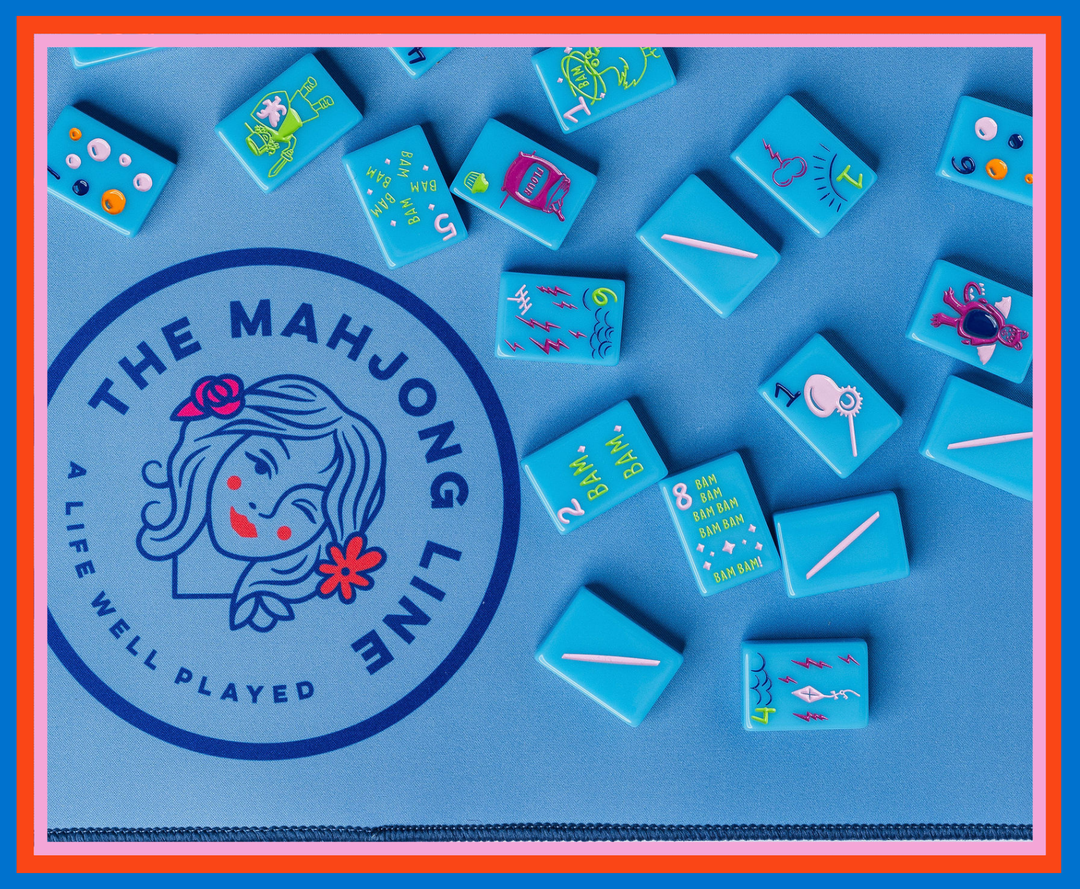 Light blue game mat paired with mahjong tiles– The Mahjong Line