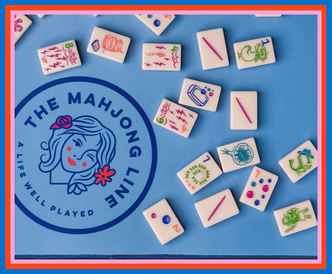 Light blue game mat paired with mahjong tiles– The Mahjong Line