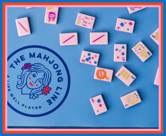 Light blue game mat paired with mahjong tiles– The Mahjong Line