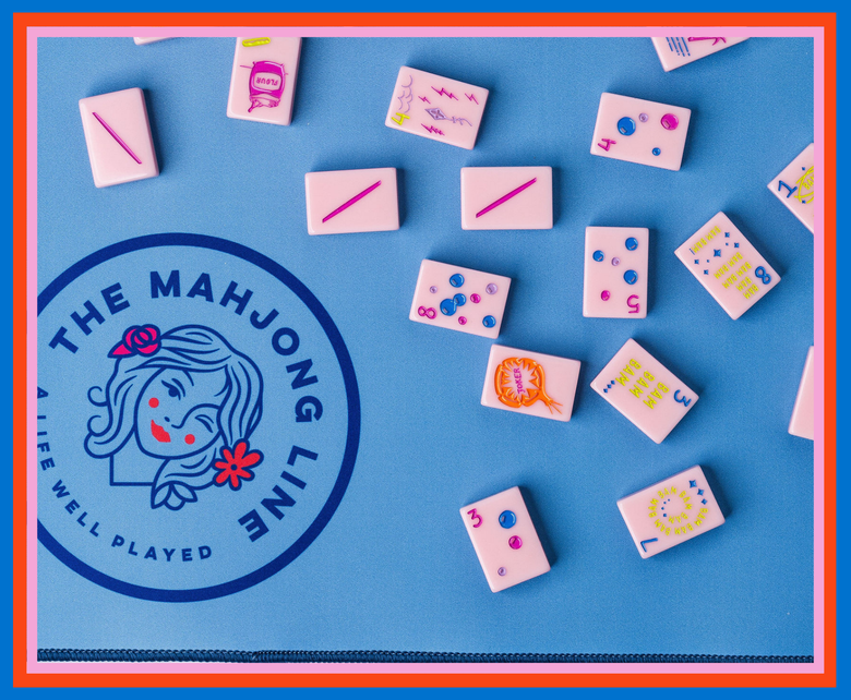 Light blue game mat paired with mahjong tiles– The Mahjong Line
