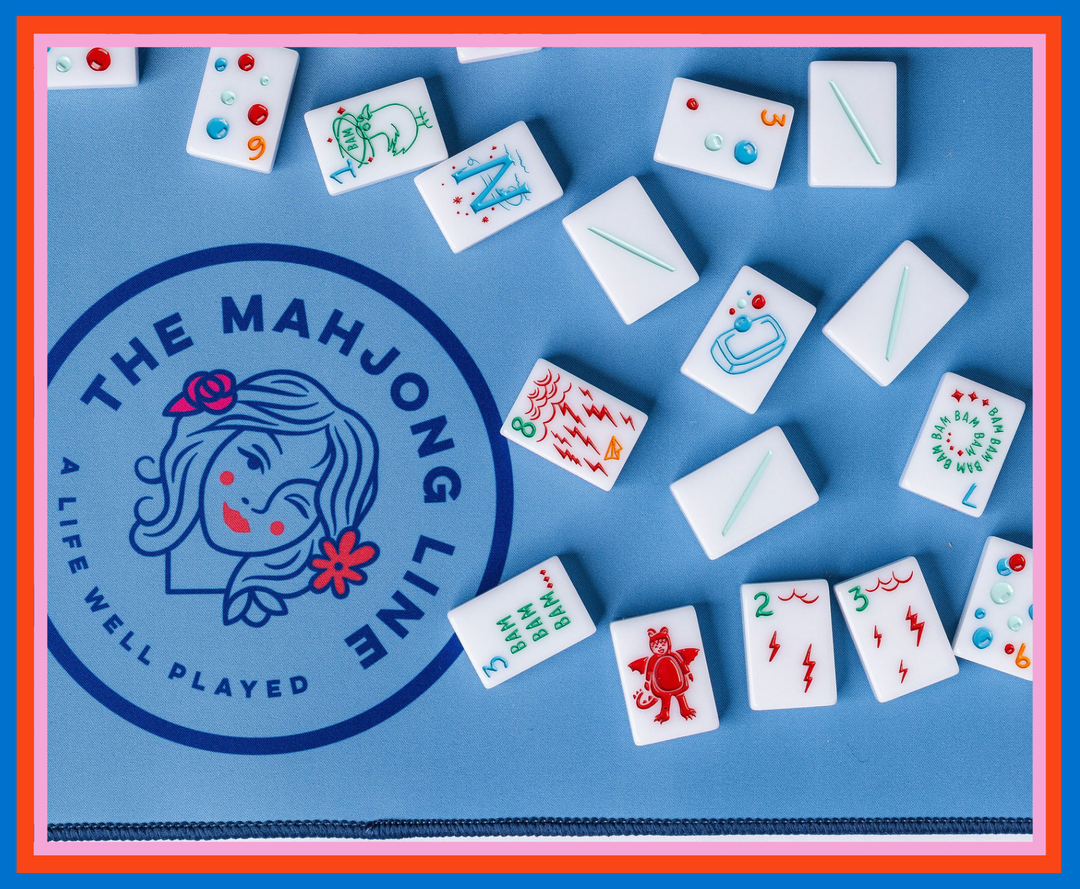 Light blue game mat paired with mahjong tiles– The Mahjong Line