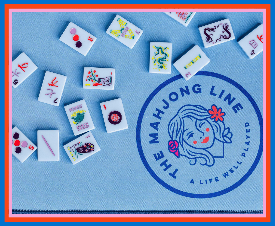 Light blue game mat paired with mahjong tiles– The Mahjong Line