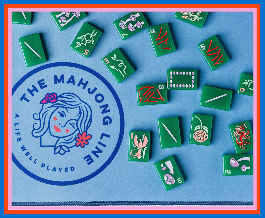 Light blue game mat paired with mahjong tiles– The Mahjong Line