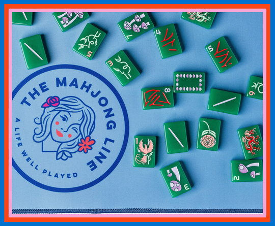 Light blue game mat paired with mahjong tiles– The Mahjong Line